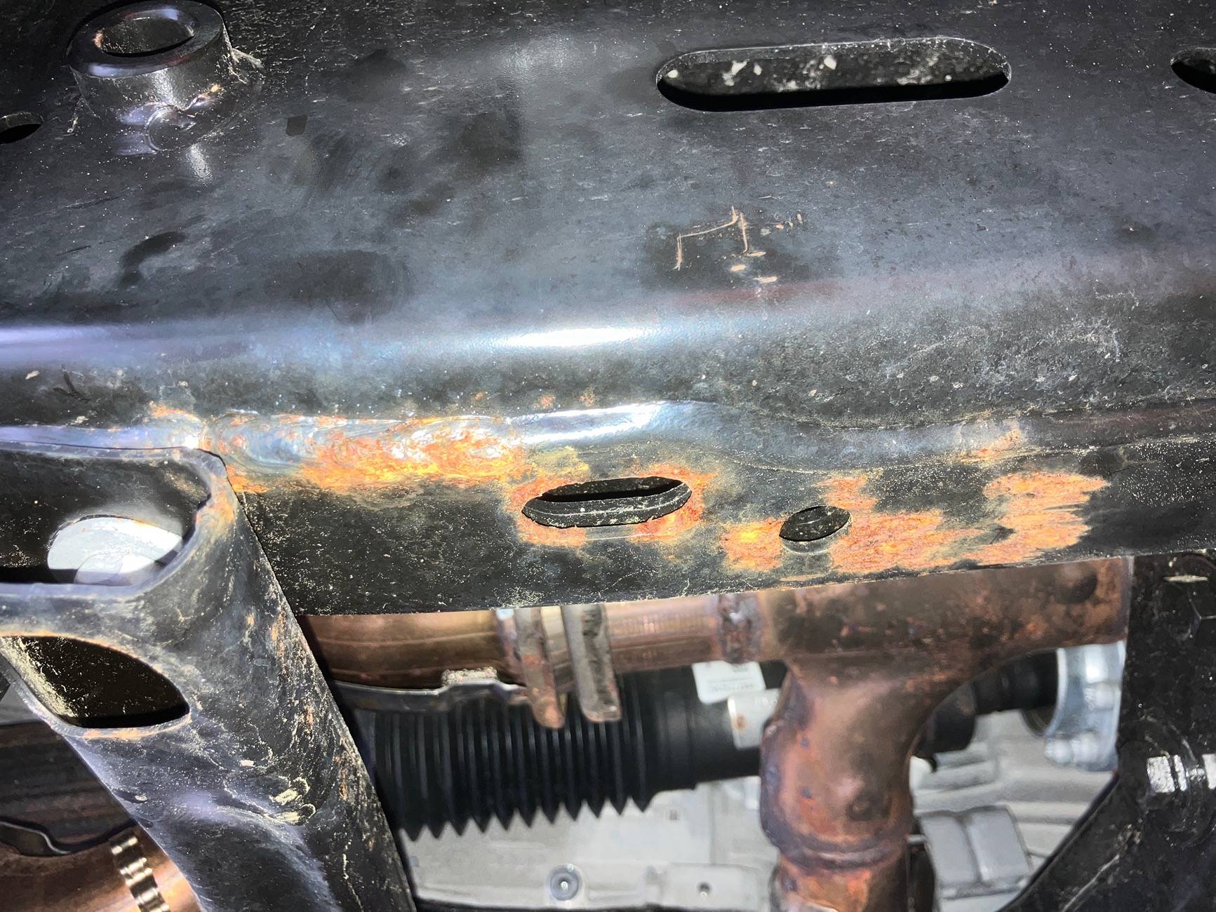 Rust under 2024 Gladiator with 90 miles it, on dealer lot. Pics below ...